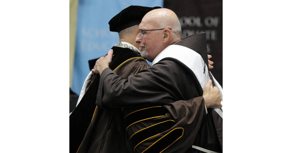 SBU Honors Father Dan Riley With Doctorate at Commencement | Greater ...