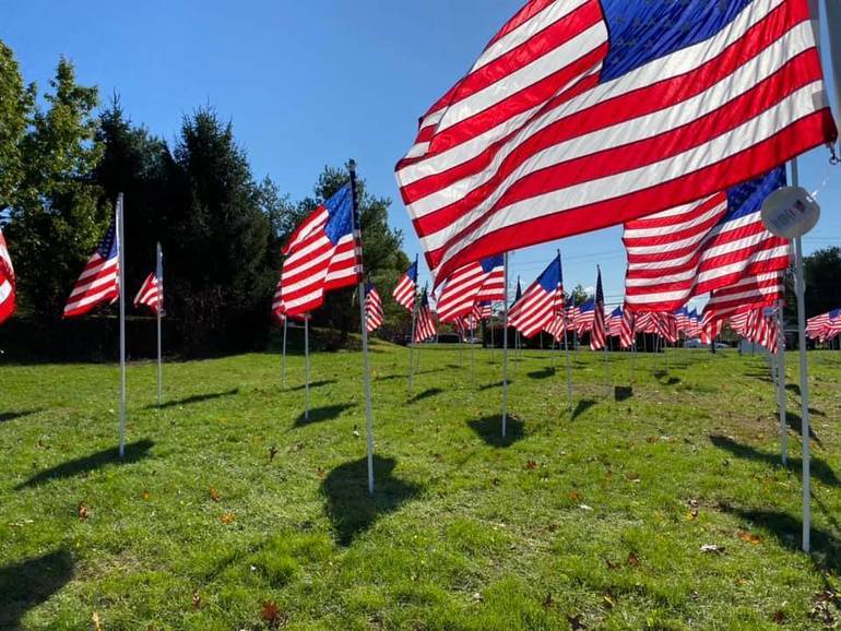 Rotary Club Extending Flags for Heroes Display | TAPinto